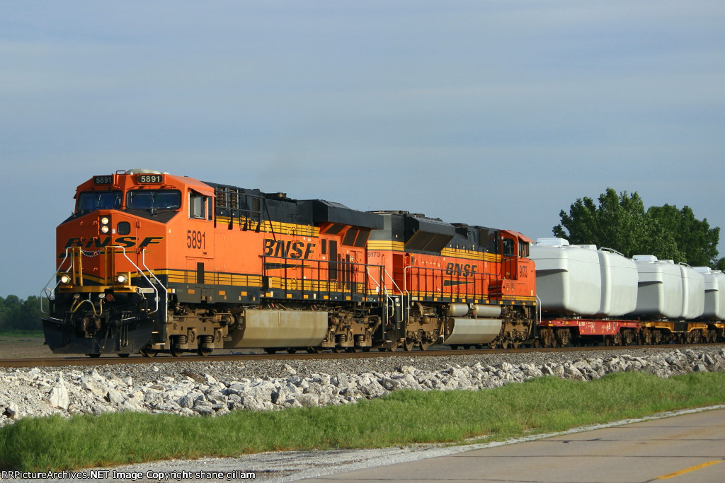BNSF 5891 hauls the memgal north with some wind turbines.